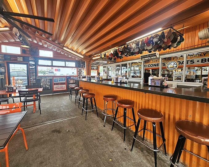 Step inside and the wooden ceiling beams, classic counter, and baseball cap collection tell you this isn't just a restaurant—it's a community institution.