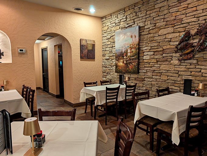 Stone walls and white tablecloths create that perfect middle ground between "fancy enough for an anniversary" and "comfortable enough to unbutton after the entrée."