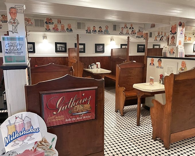 Step inside and time stands still – wooden booths, checkered floors, and walls adorned with caricatures create the perfect backdrop for comfort food perfection.