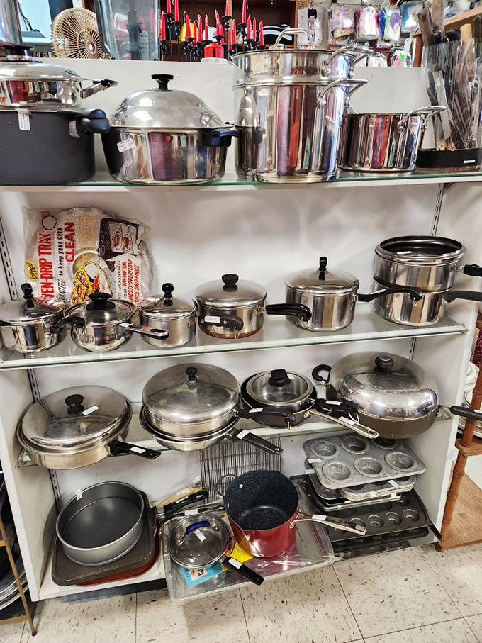 Kitchen treasures stacked with military precision. Somewhere in this gleaming arsenal of cookware is the exact pot your grandmother used to make Sunday gravy.