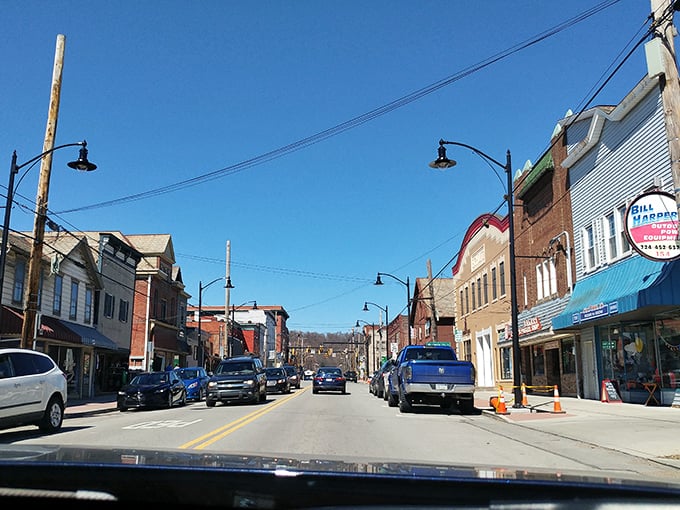 Blue skies frame Zelienople's historic downtown, where locally-owned businesses still outnumber chain stores—a Main Street that actually matters.