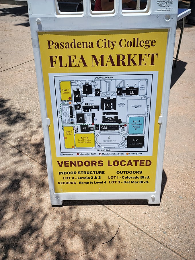 Your treasure map to bargain bliss. This yellow sign doesn't just show directions—it reveals where your next vintage obsession is hiding.