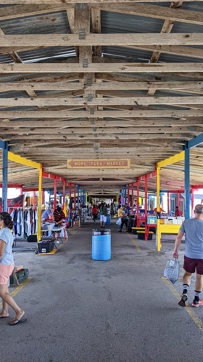 The rustic wooden beams overhead tell stories of decades past, while the colorful support columns guide treasure hunters through this retail wilderness.