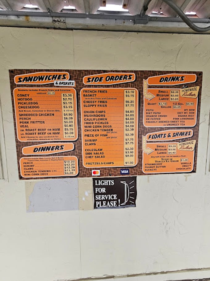 This no-frills menu board tells you everything you need to know—life's simple pleasures spelled out in orange and white, with that crucial "LIGHTS FOR SERVICE" reminder.
