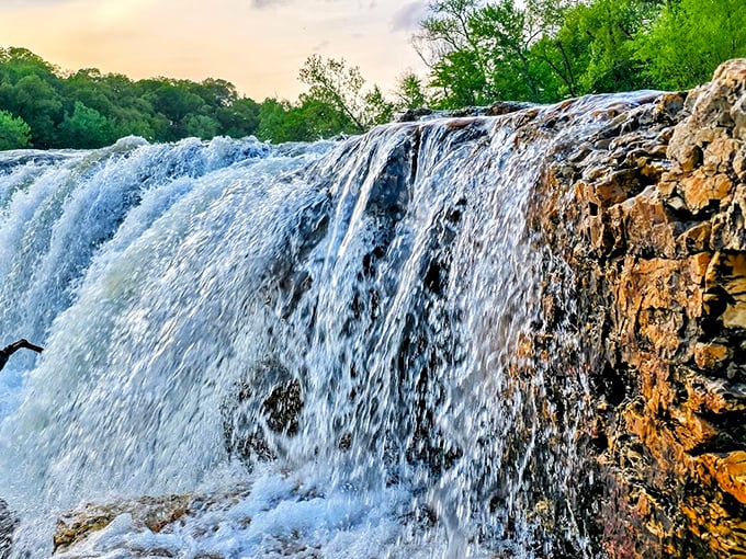 Up close with the cascade's raw power. The water doesn't just fall—it performs, creating a natural symphony you can hear from hundreds of yards away.