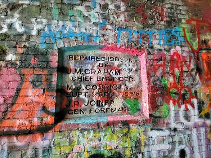This weathered plaque from 1903 tells a silent story of railroad engineers who never imagined their work would become a ghost hunter's paradise.