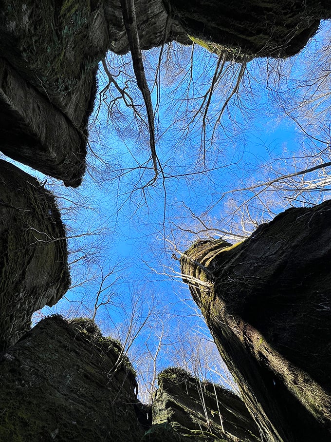 Looking up from the depths of these ancient rock formations feels like peering through nature's cathedral windows. The sky never looks quite as blue as when framed by 300-million-year-old stone.