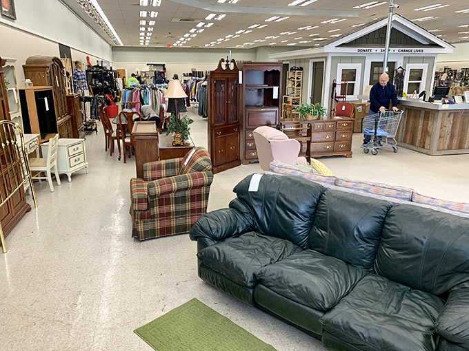 Furniture heaven awaits inside, where leather couches and wooden cabinets stand ready for their second act in someone's living room story.
