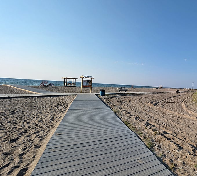 A wooden boardwalk invites you into beach bliss. No "keep off the grass" signs here—just an open invitation to sandy paradise.