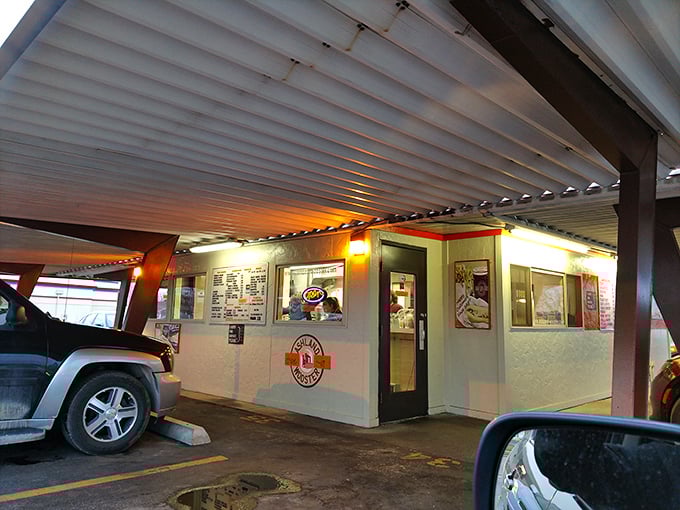 Where culinary magic happens under a slanted roof. The ordering window—a portal to simpler, more delicious times.