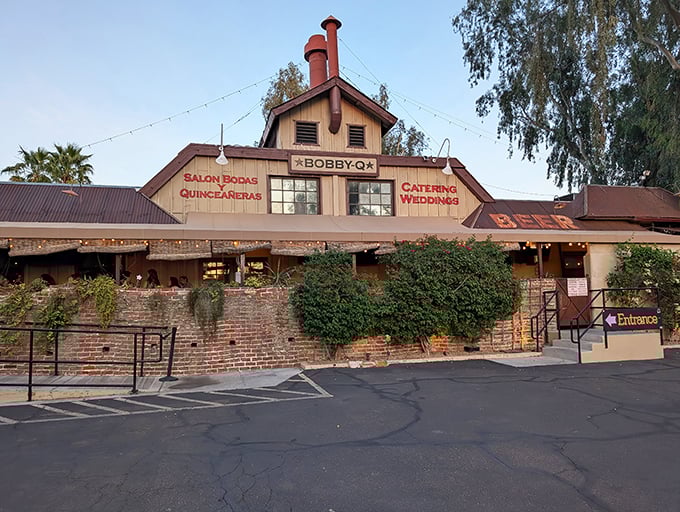Bobby-Q's historic building wrapped in vibrant bougainvillea – where brick, blooms, and barbecue create a feast for all senses.