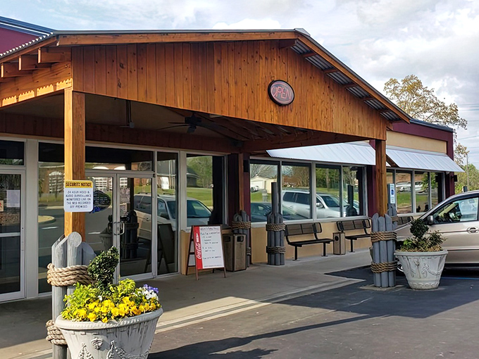 Don't judge this rustic beauty by its humble exterior – sometimes the best pizza comes from the most unassuming places.