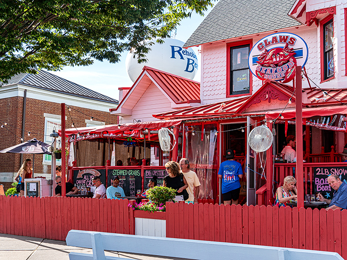 Claws Seafood House's eye-catching pink building with red trim stands out like a flamingo at a penguin party.