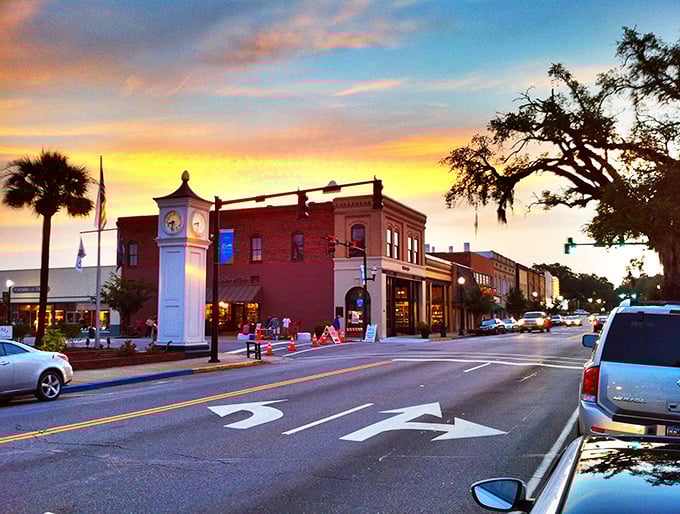 Conway's sunset-kissed downtown showcases its historic clock tower against a painted sky. Time literally stands still in this picturesque riverfront gem.