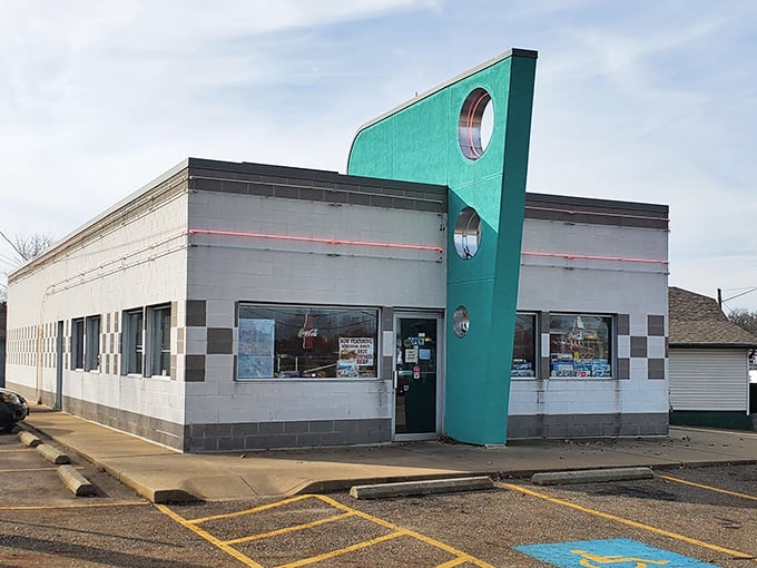 Doug's Classic '57 sports that unmistakable teal fin – architectural proof that food just tastes better when served with a side of nostalgia.