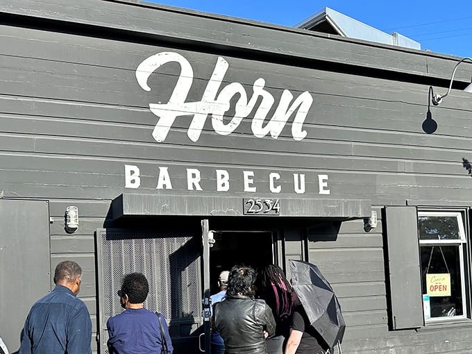Horn Barbecue's understated gray exterior hides Oakland's worst-kept secret. Like finding a Michelin star in a lunch box—simple outside, extraordinary inside.