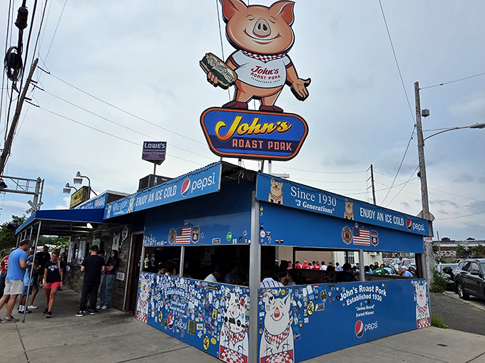 John's smiling pig mascot has witnessed decades of sandwich perfection. If logos could talk, this one would say "worth the wait!"