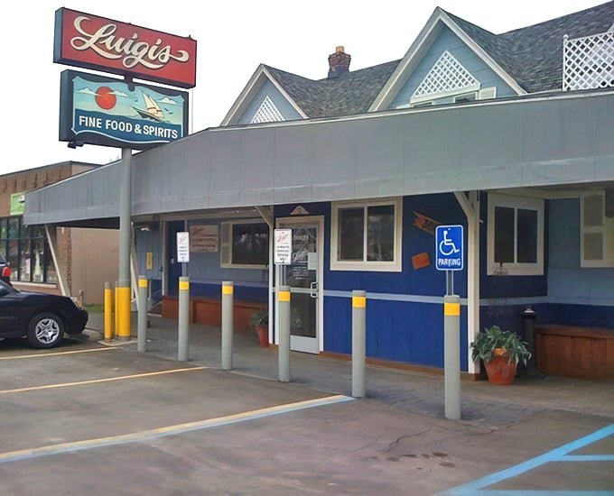 Luigi's cheerful blue exterior welcomes hungry visitors like an old friend. That sign promises "Fine Food & Spirits" – and it delivers!
