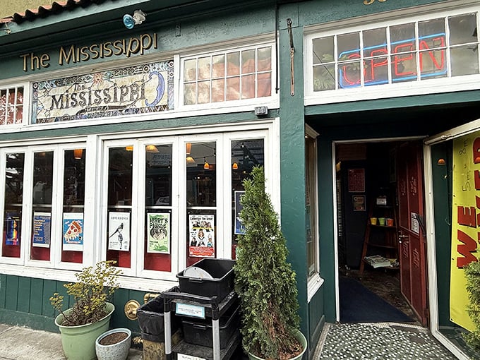 The Mississippi Pizza's emerald exterior houses more than great pies—it's a Portland institution where food meets culture.