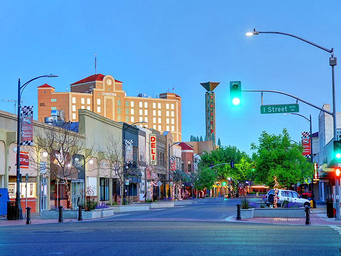 Modesto after dark has a certain magic—storefronts beckon with local treasures while that grand building watches over the evening bustle.