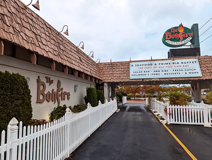 The Bonfire's charming entrance, complete with white picket fence, hides a 100-foot buffet inside. Like finding Narnia, but instead of a magical forest, you discover endless crab legs.