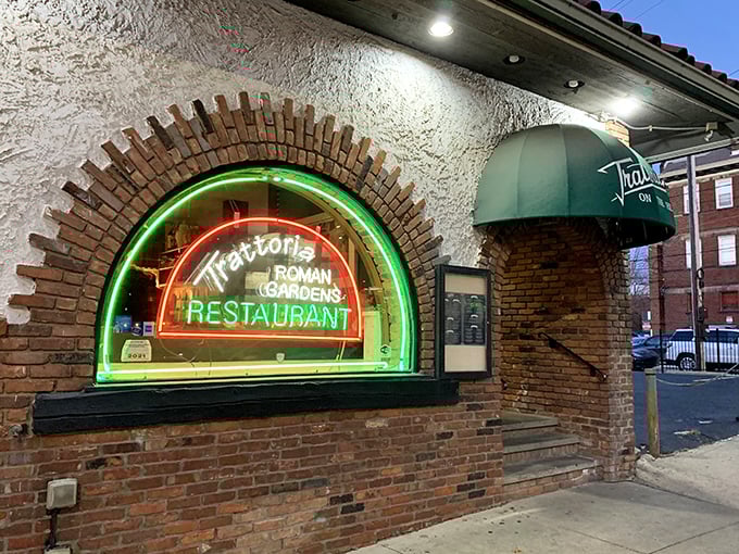 That glowing neon arch at Trattoria Roman Garden isn't just a sign—it's a portal to pasta paradise.