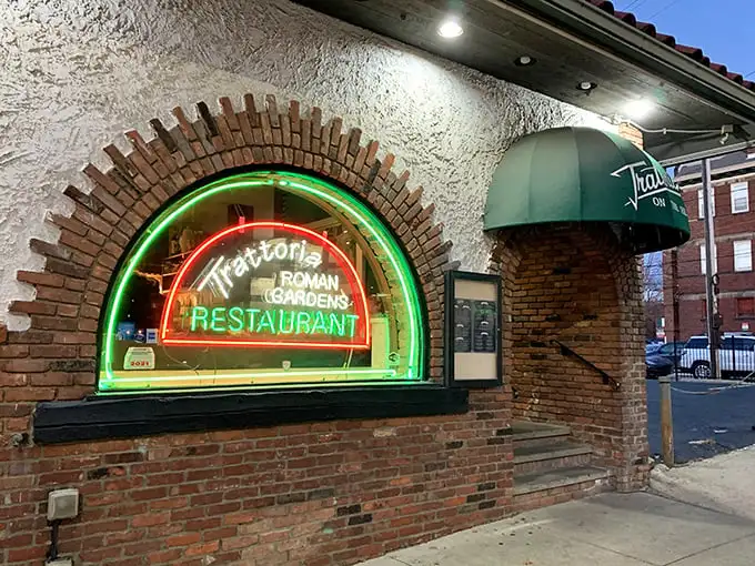 That glowing neon arch at Trattoria Roman Garden isn't just a sign—it's a portal to pasta paradise.