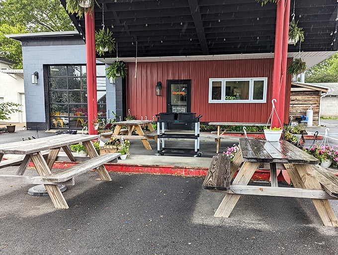 Picnic tables and smokers under the sky – Uncle John's outdoor setup is barbecue in its natural habitat.
