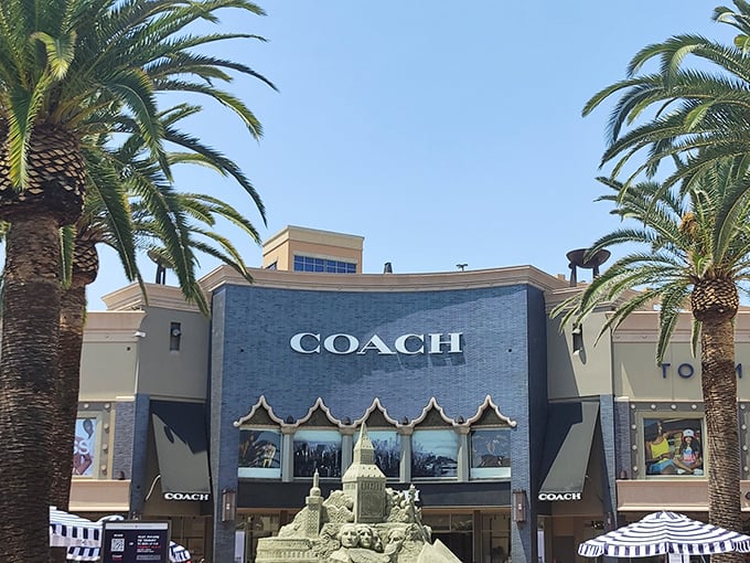 Coach's blue awning beckons like a retail oasis at the Citadel. Those aren't mirages – they're real designer discounts!