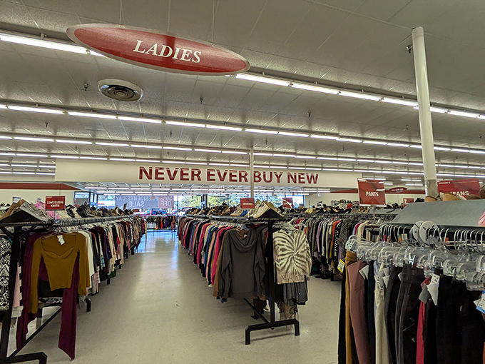 "NEVER EVER BUY NEW" – now that's a manifesto I can get behind! These clothing racks stretch like an endless buffet of fashion possibilities.
