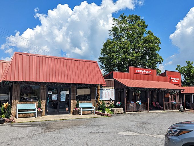 The rustic red building houses a simple concept with extraordinary results: hot dogs transformed by a magical dip and sizzle.
