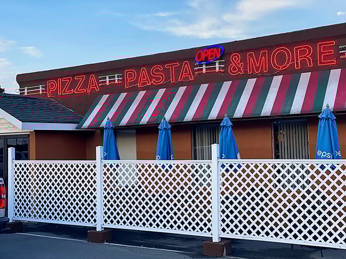 Those red, white, and green awnings aren't just pretty – they're a promise of Italian flavors waiting inside.