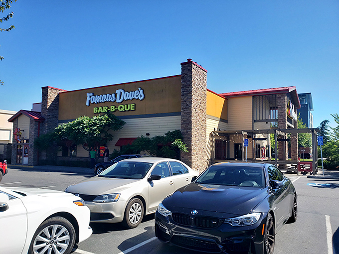 Sunshine gleams off Famous Dave's welcoming exterior – a modern-day oasis for road-weary travelers seeking smoky salvation.