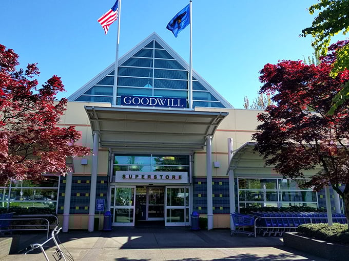 The blue glass peak of this Goodwill superstore catches the morning light. Thrift shopping with a touch of class—no polyester suit required.