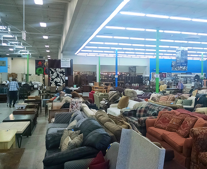 Couches upon couches at Habitat ReStore—enough seating for a family reunion of the Kardashians and the Waltons combined.