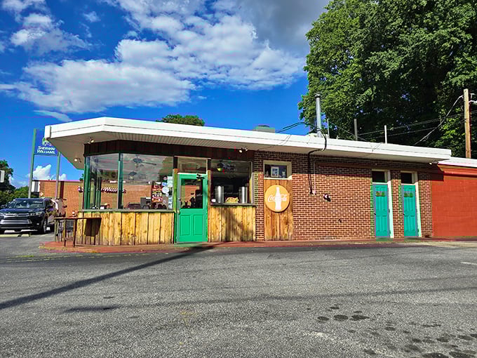 Those bright green doors? Consider them portals to pork paradise, where hickory smoke perfumes the air like nature's cologne.
