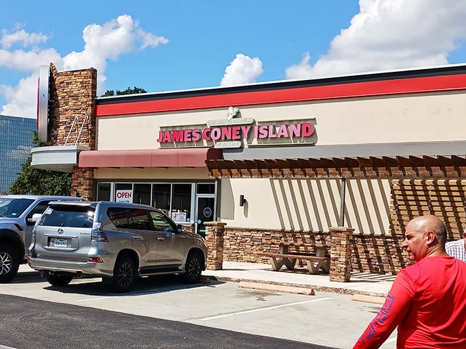 Bright red signage against cream walls – James Coney Island stands ready to satisfy your hot dog cravings with Texas-sized flavor.