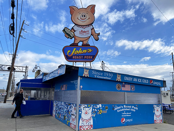 The bright blue exterior of John's Roast Pork is like a sandwich oasis in the urban landscape—a colorful promise of deliciousness.