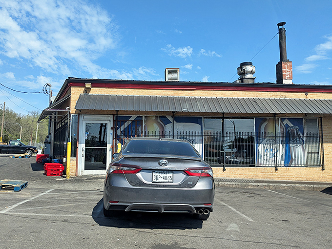 Sunshine illuminates LC's no-frills exterior – a BBQ landmark where smoke signals have been calling Kansas City's hungry for decades.