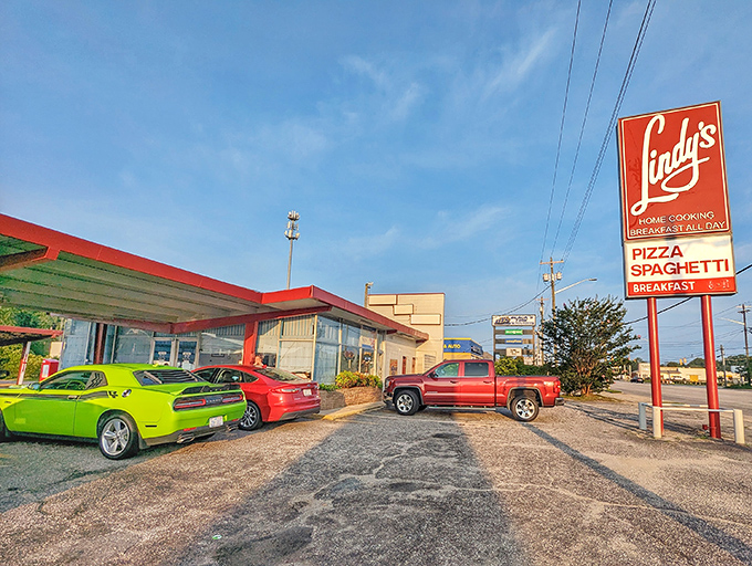 The bright red sign stands out like a lighthouse for hungry travelers. Pizza, spaghetti, AND breakfast? It's the holy trinity of diner food!