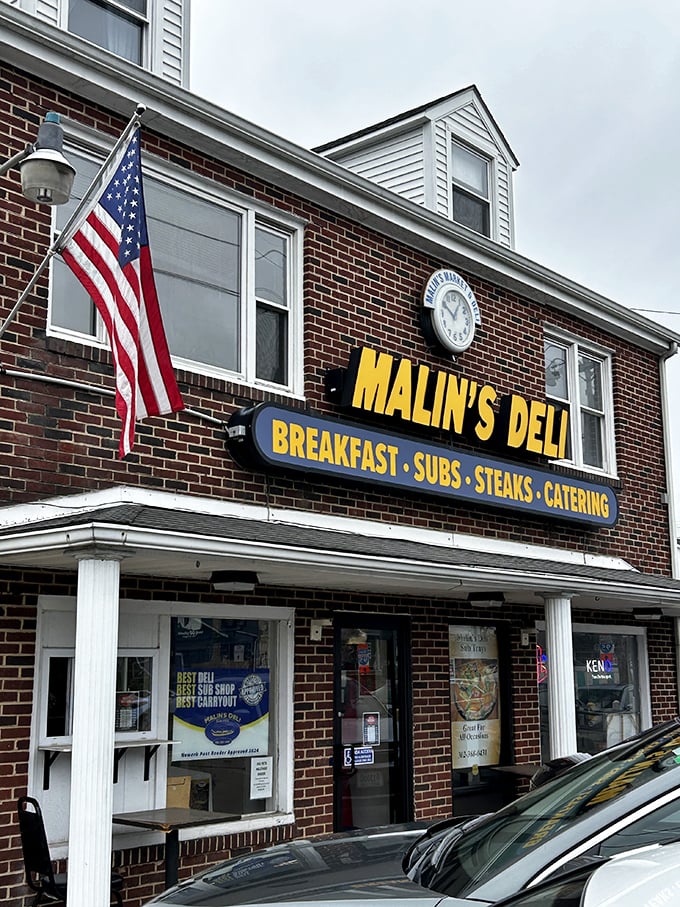 The American flag flies proudly outside Malin's, where patriotism and perfect sandwiches go hand in hand.