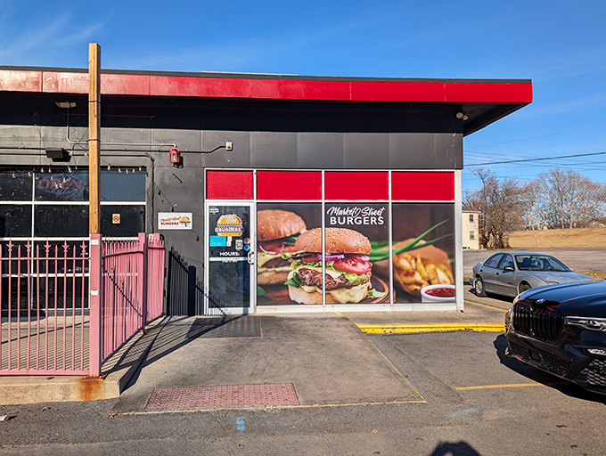 The striking black and red color scheme isn't just for show – it's advertising the sizzling experience waiting inside.