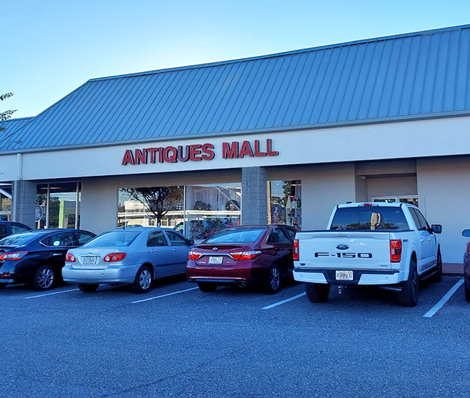 Where modern retail meets vintage charm – this antique mall's blue-roofed exterior hides a treasure trove that would make Indiana Jones detour.