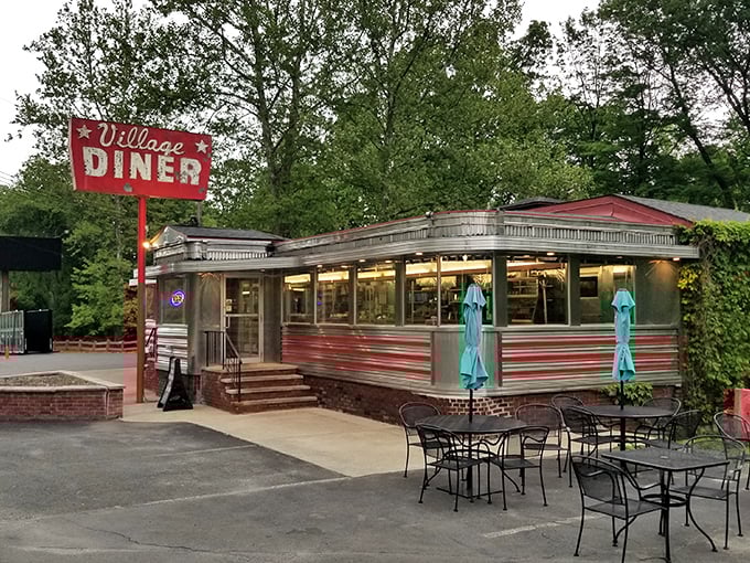 Outdoor seating at the Village Diner – where your pancakes taste even better with a side of fresh air.