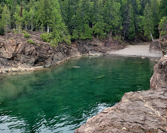 Black Rocks' emerald waters invite the brave to plunge into Lake Superior's crystal clarity—nature's own infinity pool with a refreshing 50-degree wake-up call.