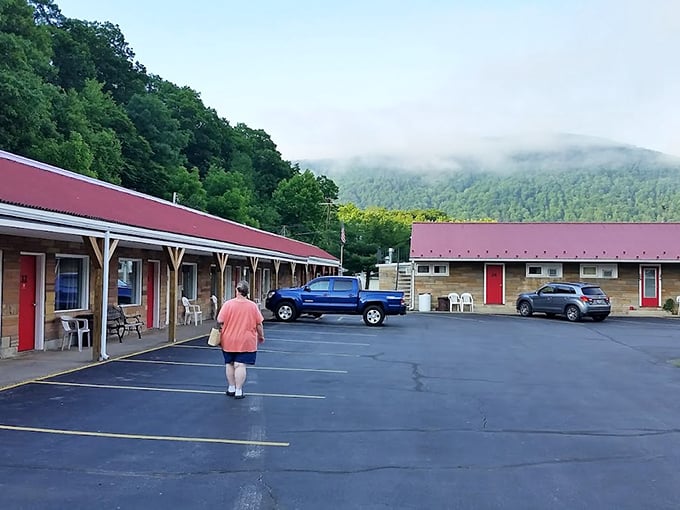 The Buttonwood Motel offers mountain views with your morning coffee that luxury hotels would feature in $500-a-night brochures—yet here it's just Tuesday.