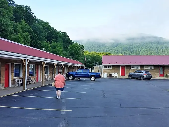 The Buttonwood Motel offers mountain views with your morning coffee that luxury hotels would feature in $500-a-night brochures—yet here it's just Tuesday.