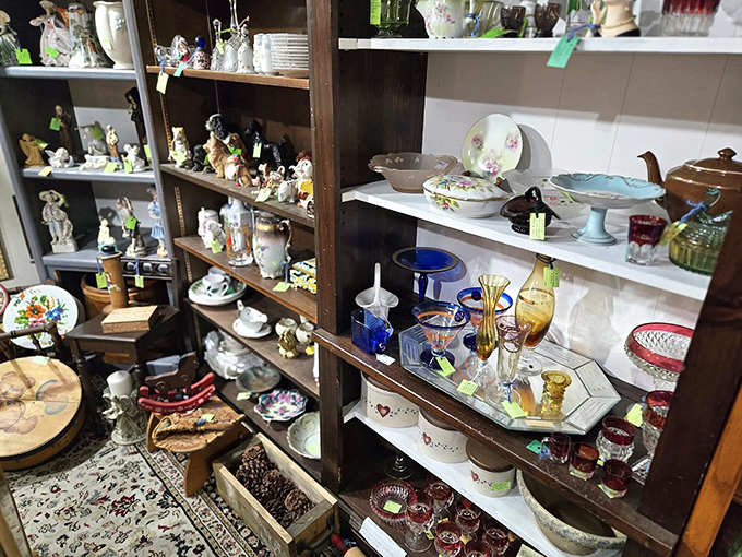Shelves lined with delicate figurines and colorful glassware tell stories of dinner parties and special occasions from generations past.