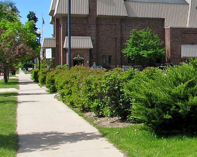Lush greenery frames Cheboygan's civic buildings, where small-town governance happens amid landscaping that would make HGTV producers swoon.