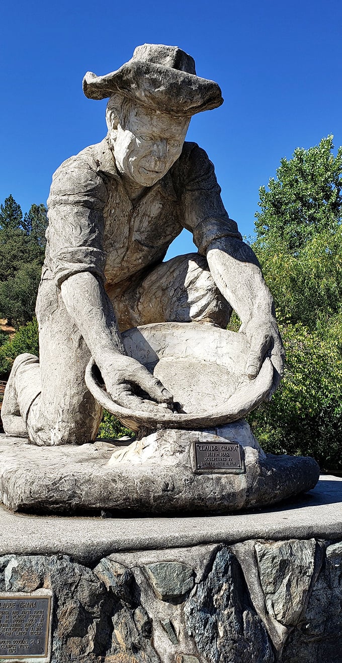 Claude Chana's statue captures the moment that launched Auburn's story. This determined gold panner looks like he means business—and found some!